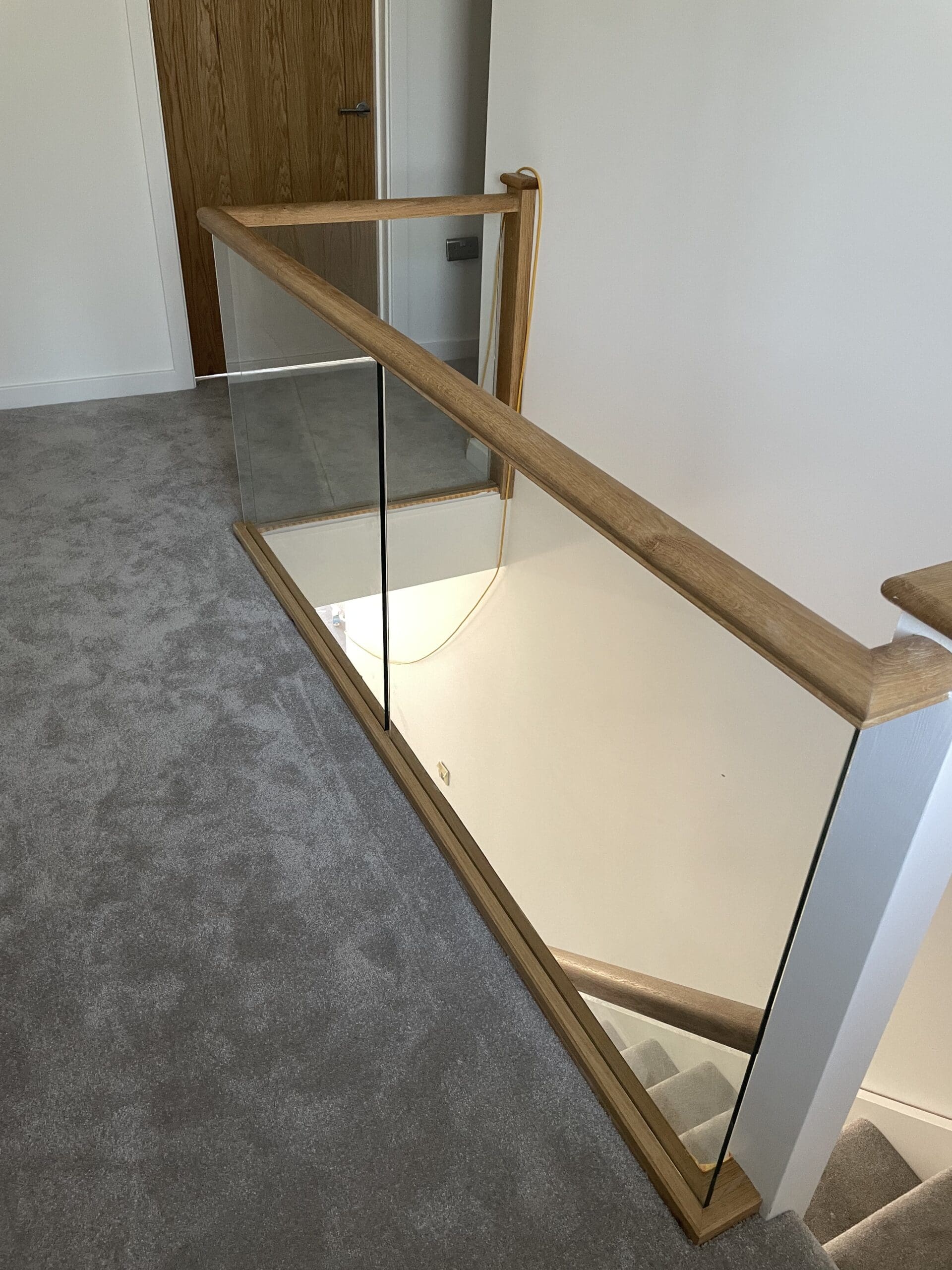 Glass Staircase Panels In Essex → Visage Glass and Steel
